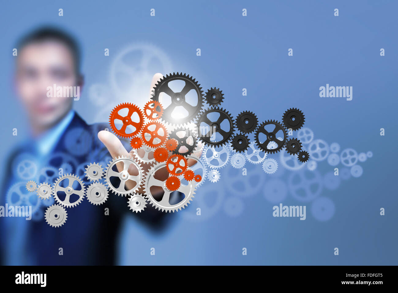 Image of businessman touching gear elements. Mechanism concept Stock ...