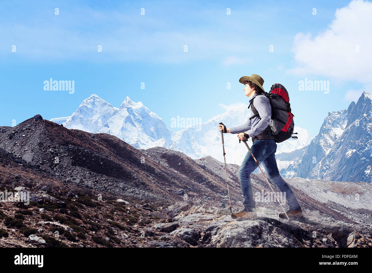 Image of young man mountaineer standing atop of rock Stock Photo - Alamy