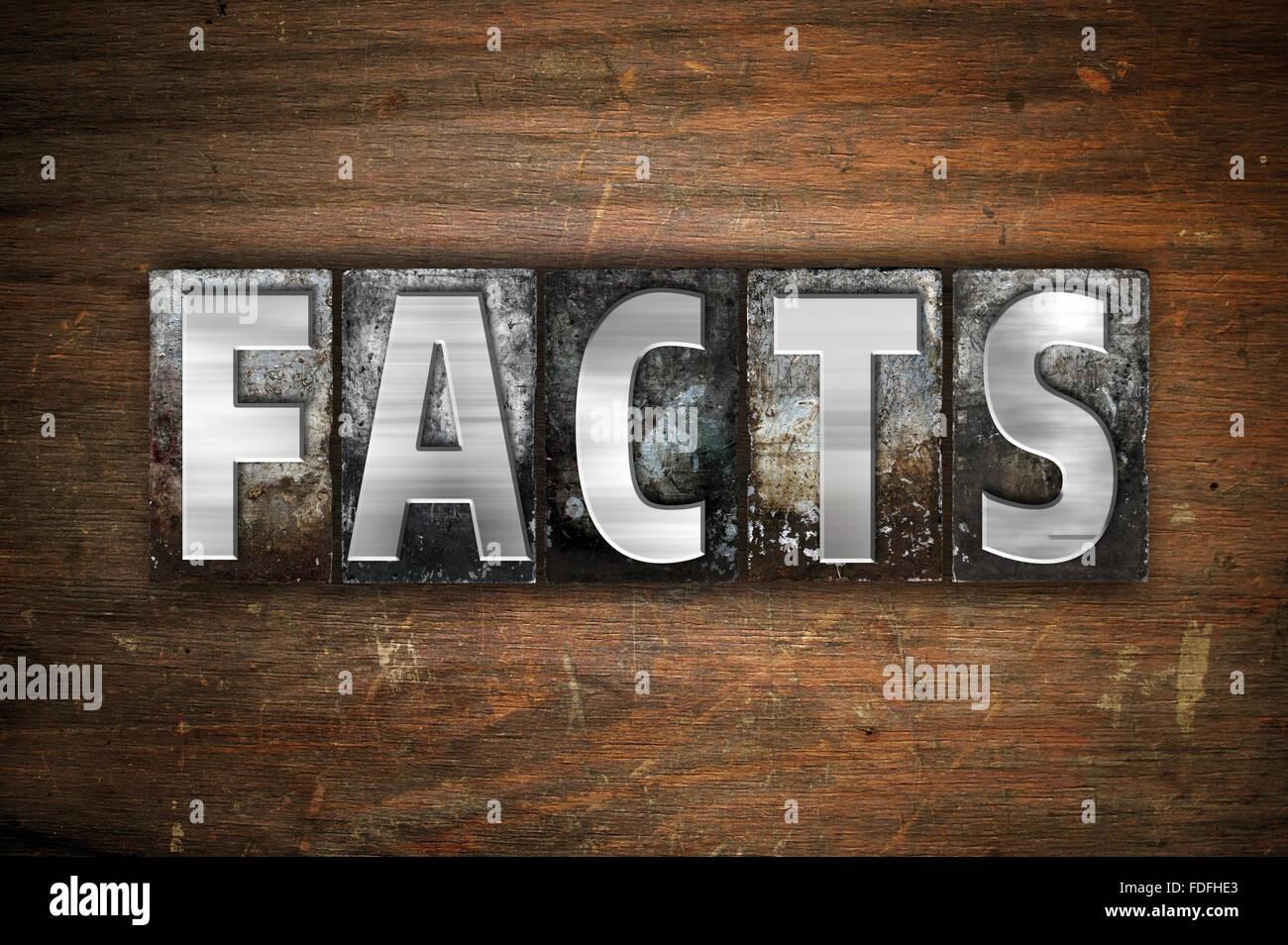 The word "Facts" written in vintage metal letterpress type on an aged ...