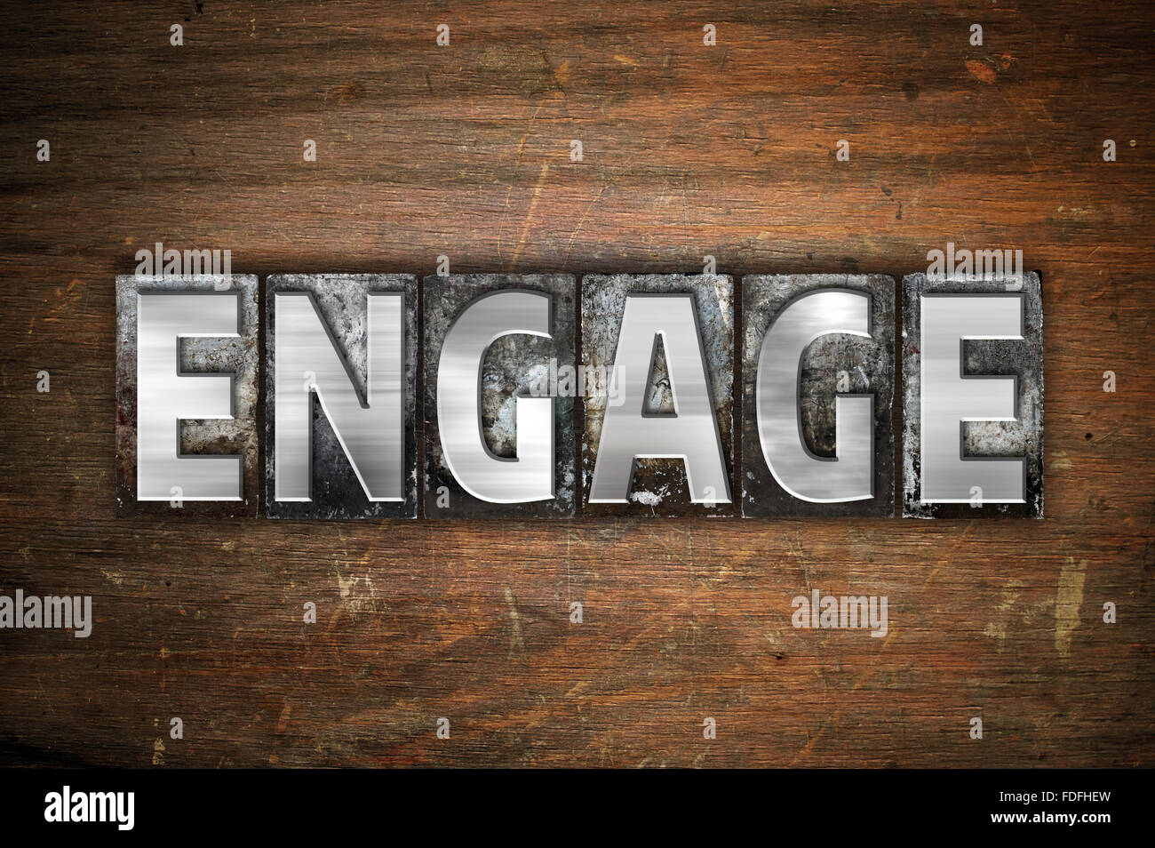 The word "Engage" written in vintage metal letterpress type on an aged ...