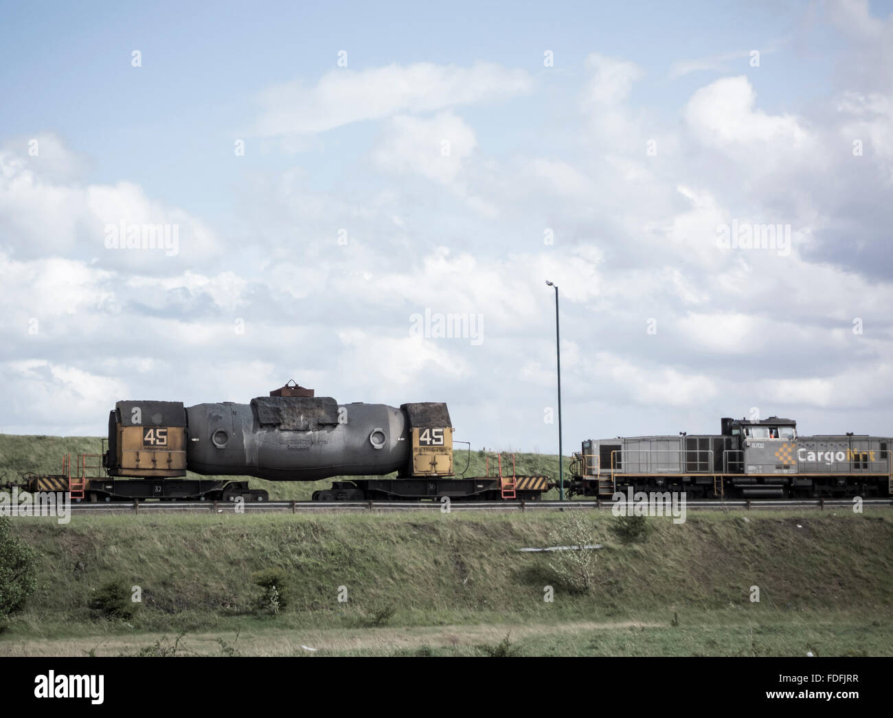 Train transporting molten iron from blast furnace inside a Torpedo ...