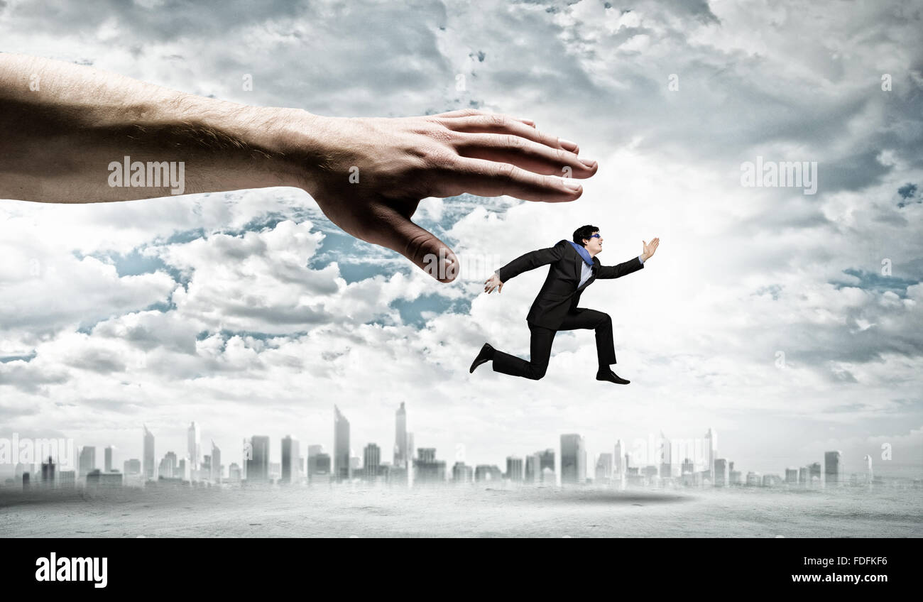 Big human hand catching businessman. Professional relations Stock Photo ...