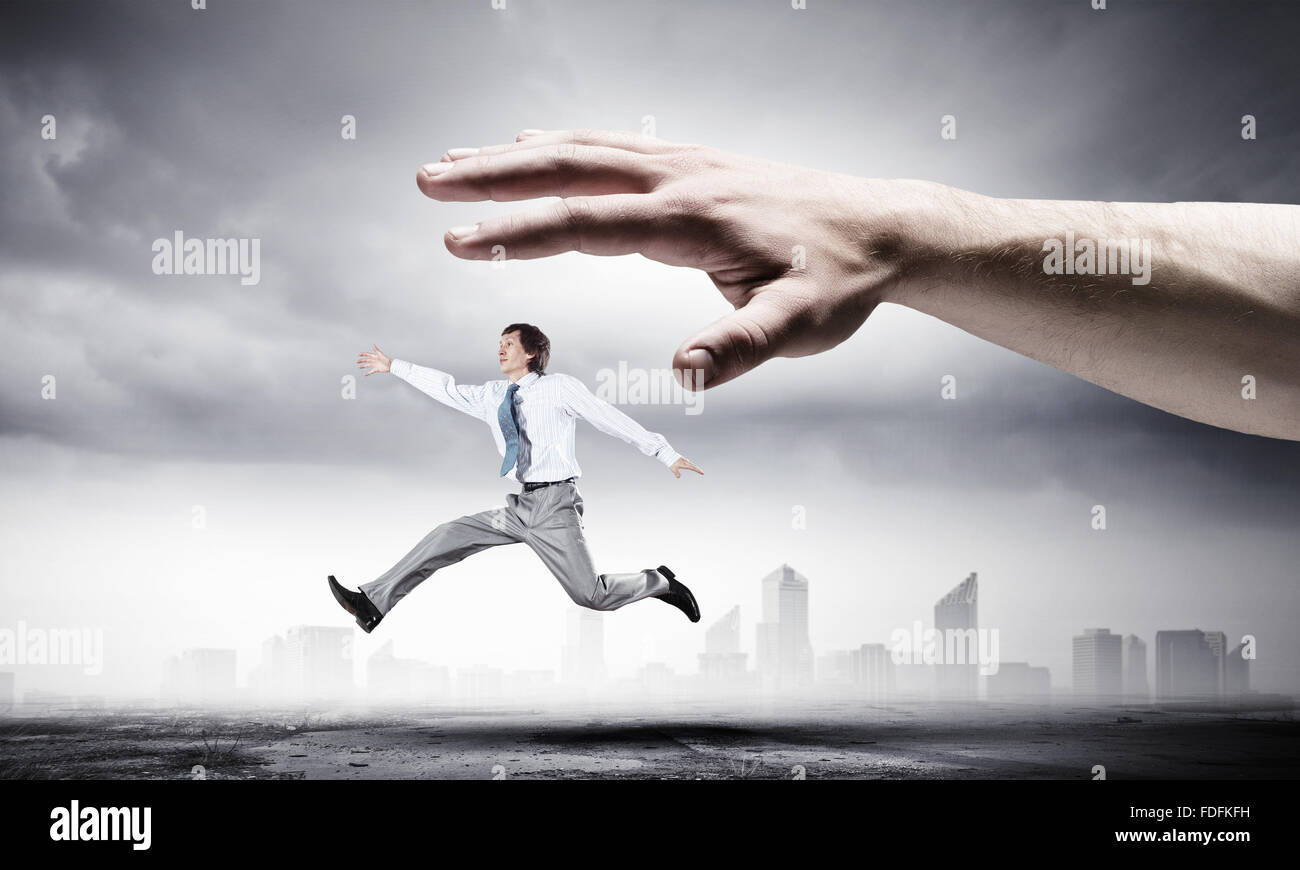 Big human hand catching businessman. Professional relations Stock Photo ...