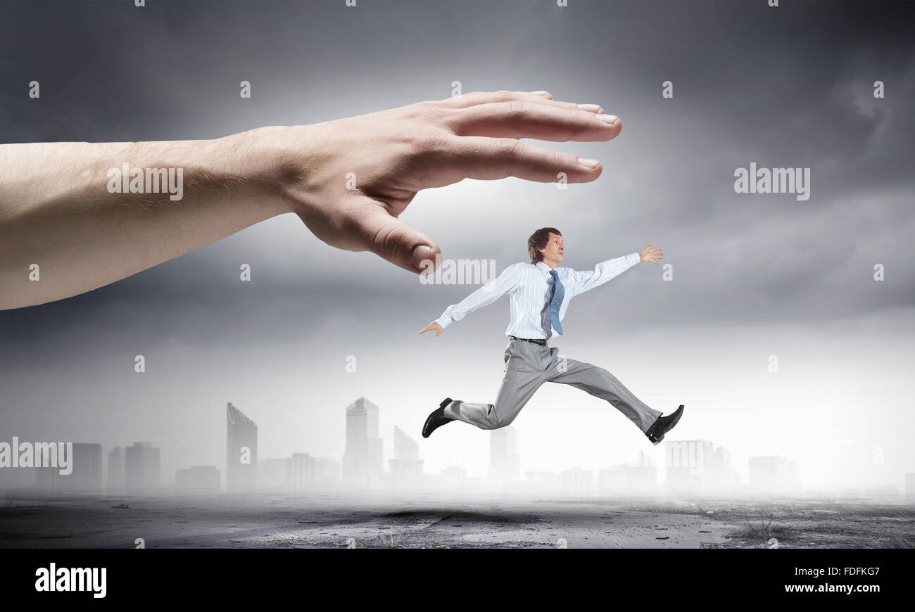 Big human hand catching businessman. Professional relations Stock Photo ...