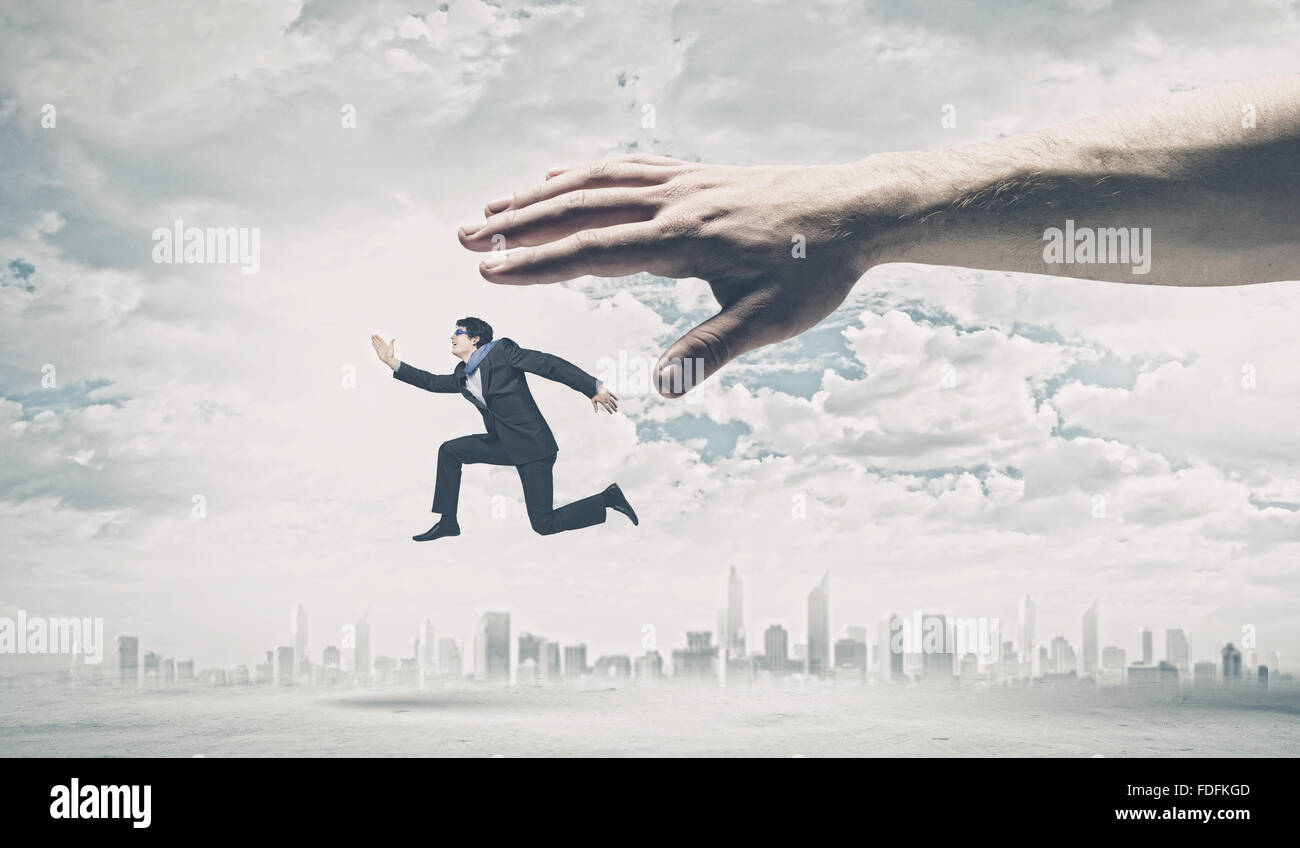 Big human hand catching businessman. Professional relations Stock Photo ...