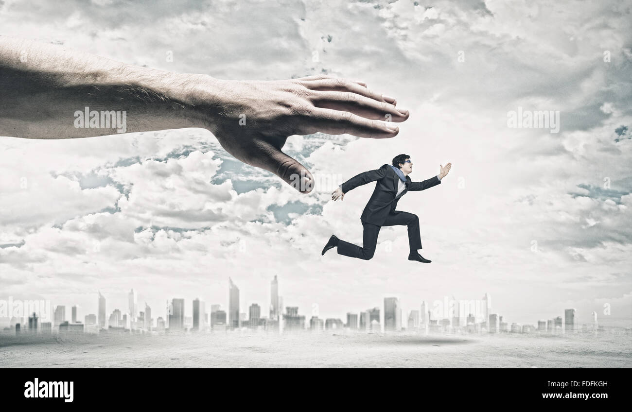 Big human hand catching businessman. Professional relations Stock Photo ...