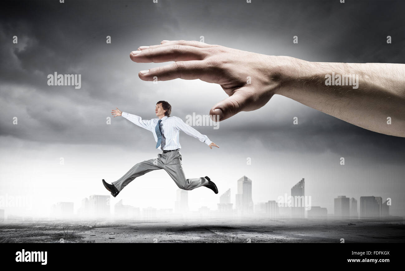 Big human hand catching businessman. Professional relations Stock Photo ...