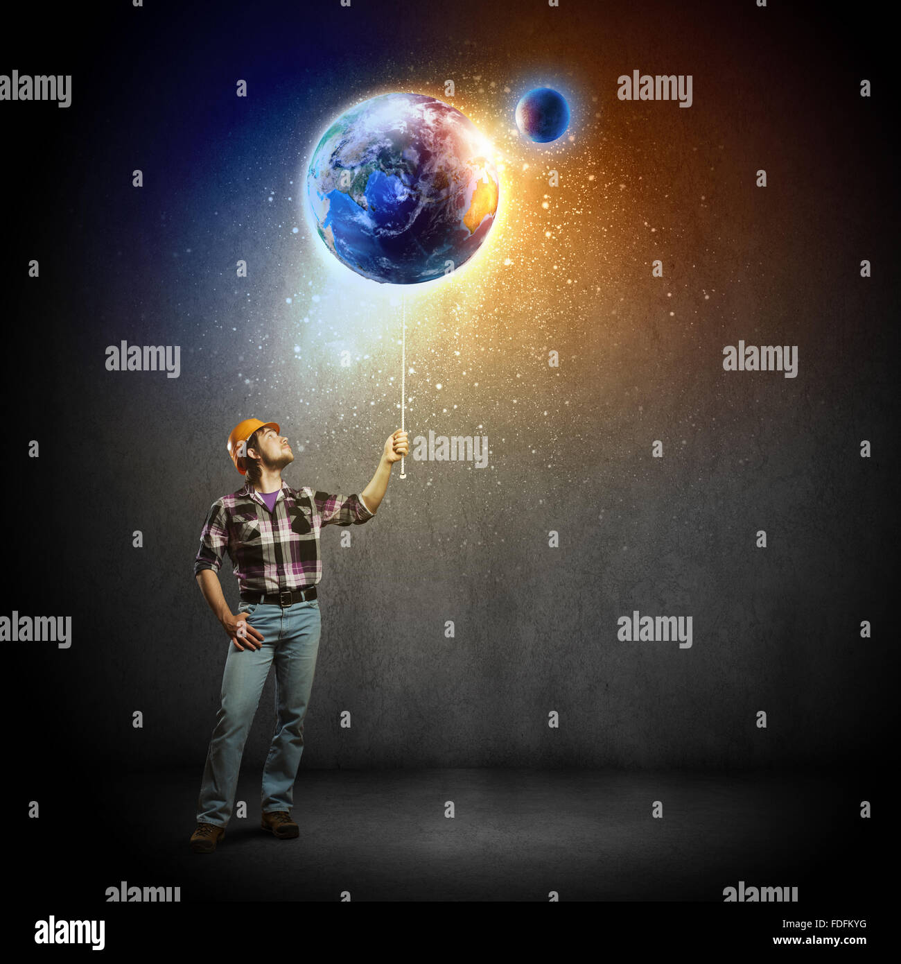 Image of man builder looking at planet Earth. Elements of this image ...
