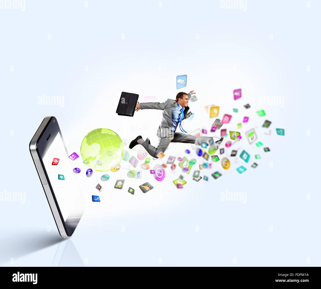 Image of businessman jumping out of mobile phone Stock Photo - Alamy