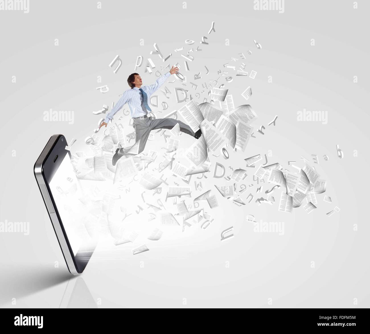 Image of businessman jumping out of mobile phone Stock Photo - Alamy