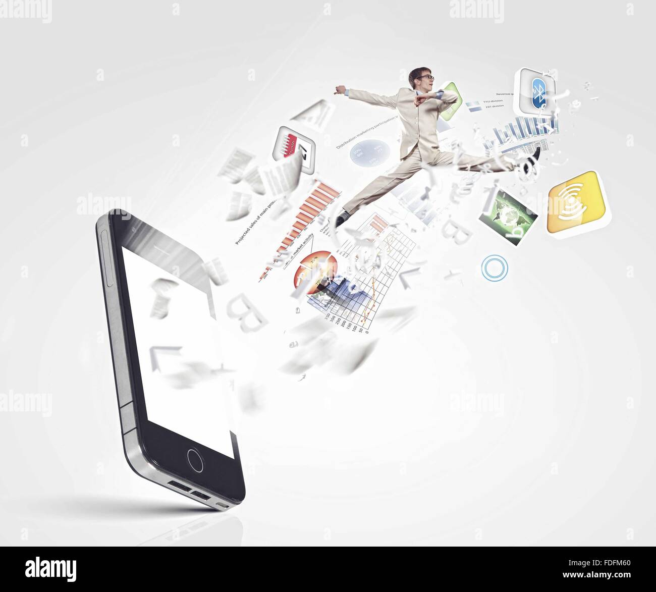 Image of businessman jumping out of mobile phone Stock Photo - Alamy