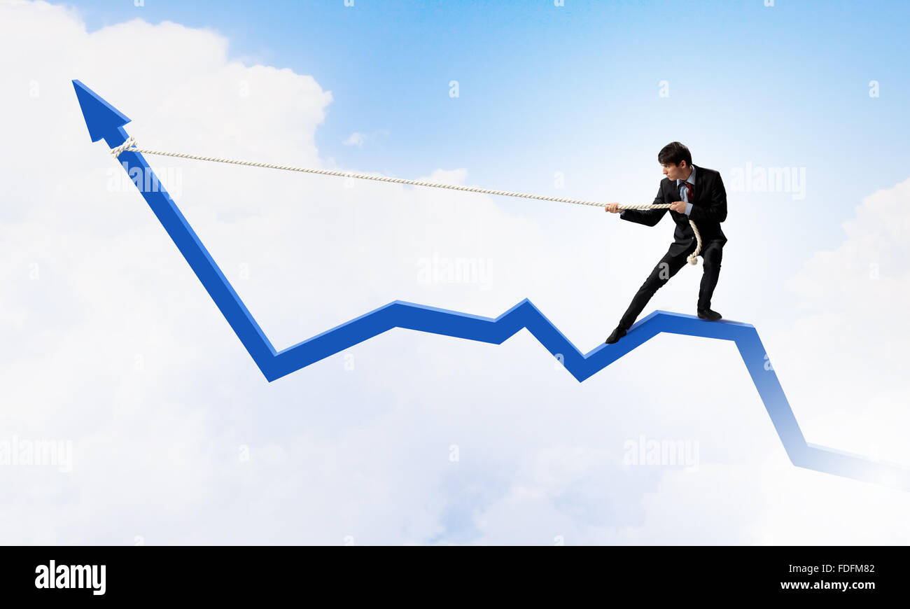 Image of businessman standing on graph and pulling it upwards Stock ...