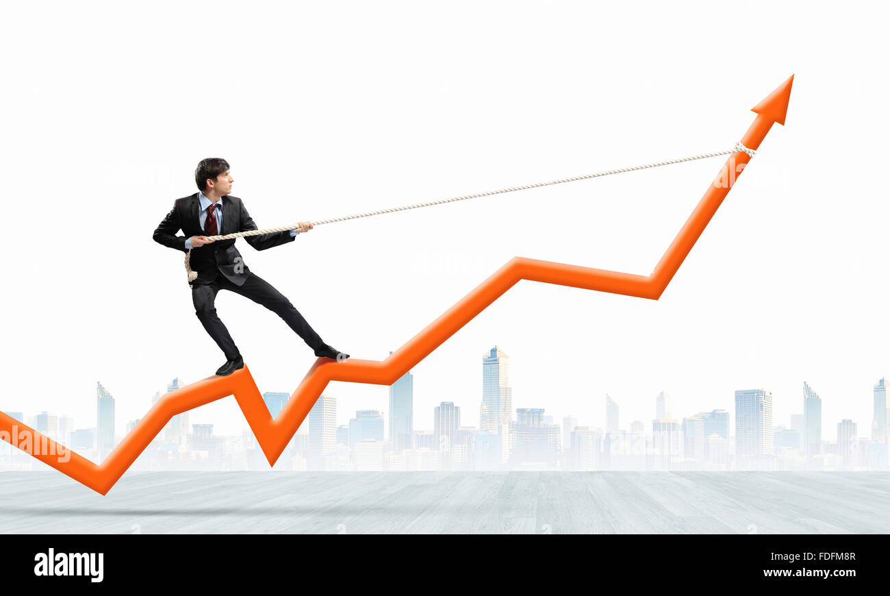Image of businessman standing on graph and pulling it upwards Stock Photo - Alamy