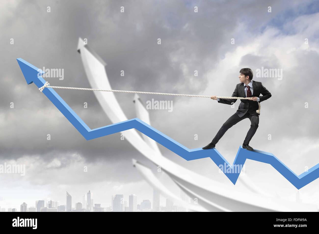 Image of businessman standing on graph and pulling it upwards Stock ...