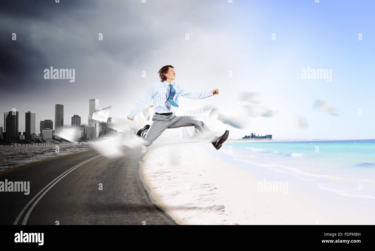 Image of businessman running away from office work Stock Photo - Alamy