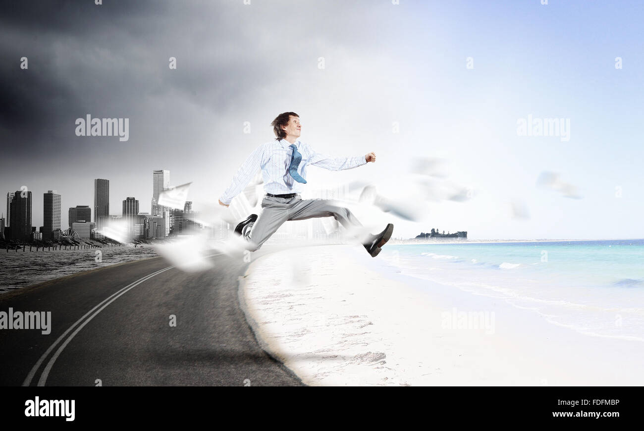 Image of businessman running away from office work Stock Photo - Alamy