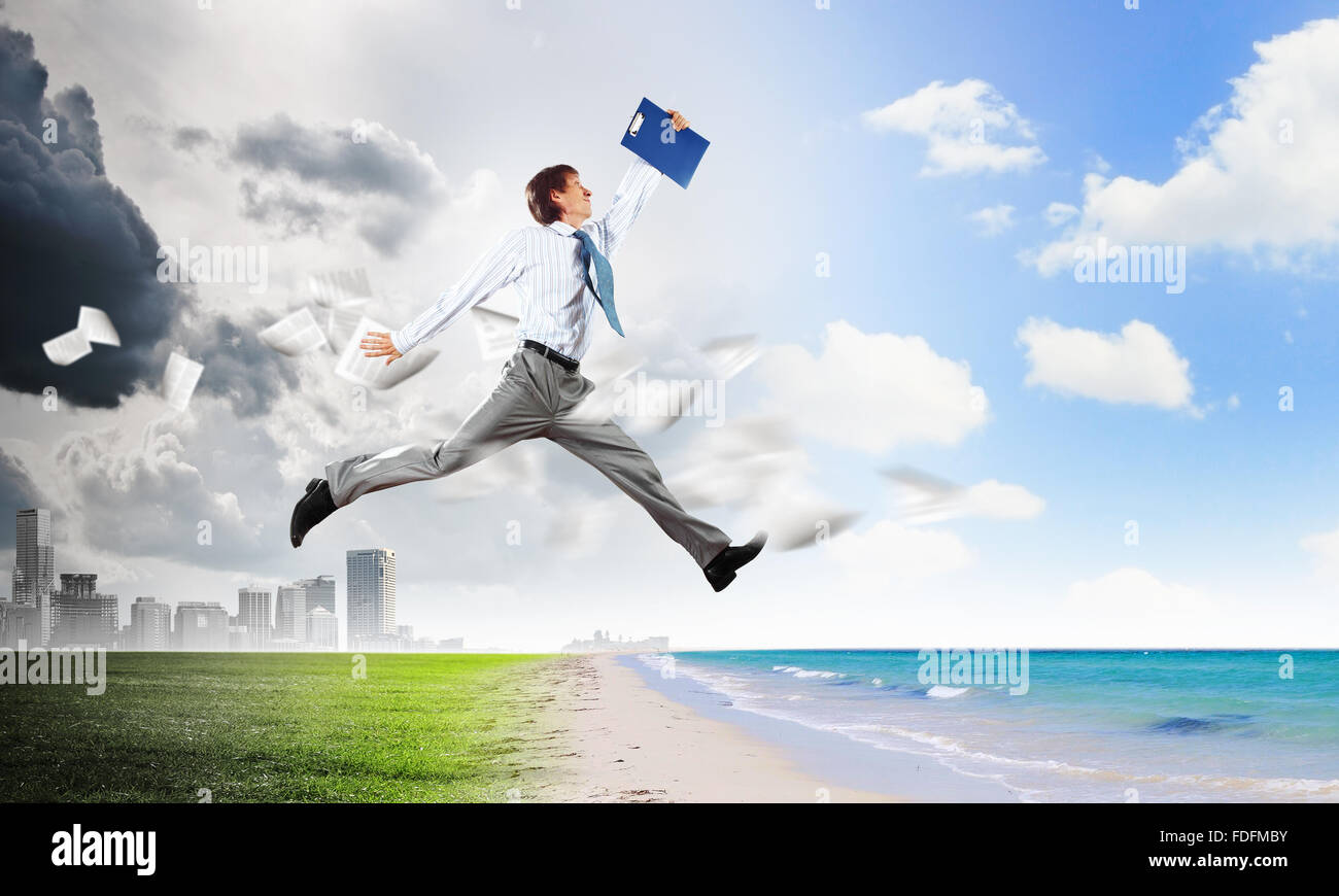 Image of businessman running away from office work Stock Photo - Alamy