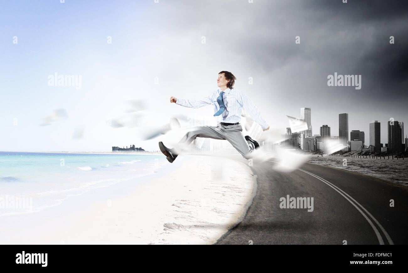 Image of businessman running away from office work Stock Photo - Alamy