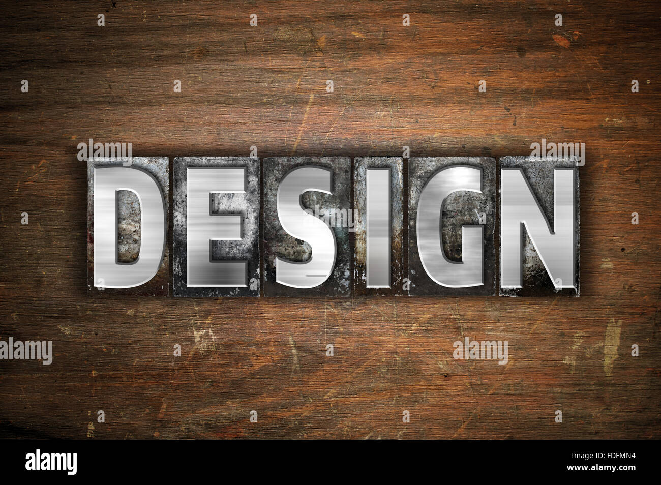 The word "Design" written in vintage metal letterpress type on an aged ...