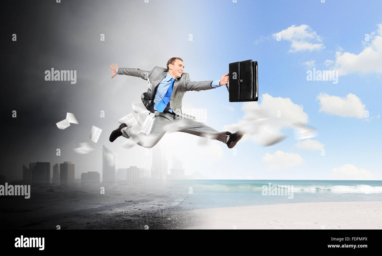 Image of businessman running away from office work Stock Photo - Alamy