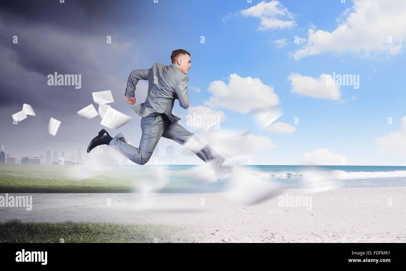 Image of businessman running away from office work Stock Photo - Alamy