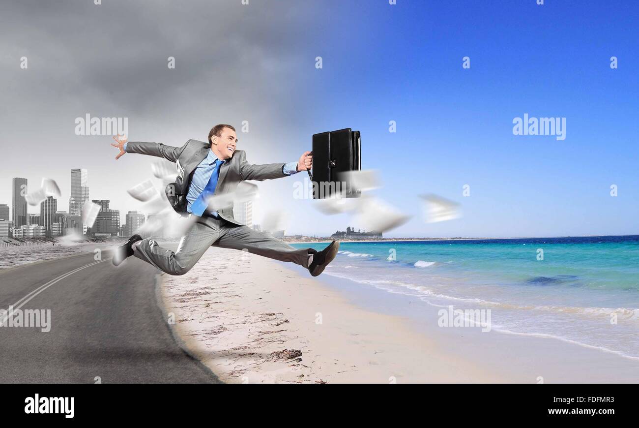 Image of businessman running away from office work Stock Photo - Alamy