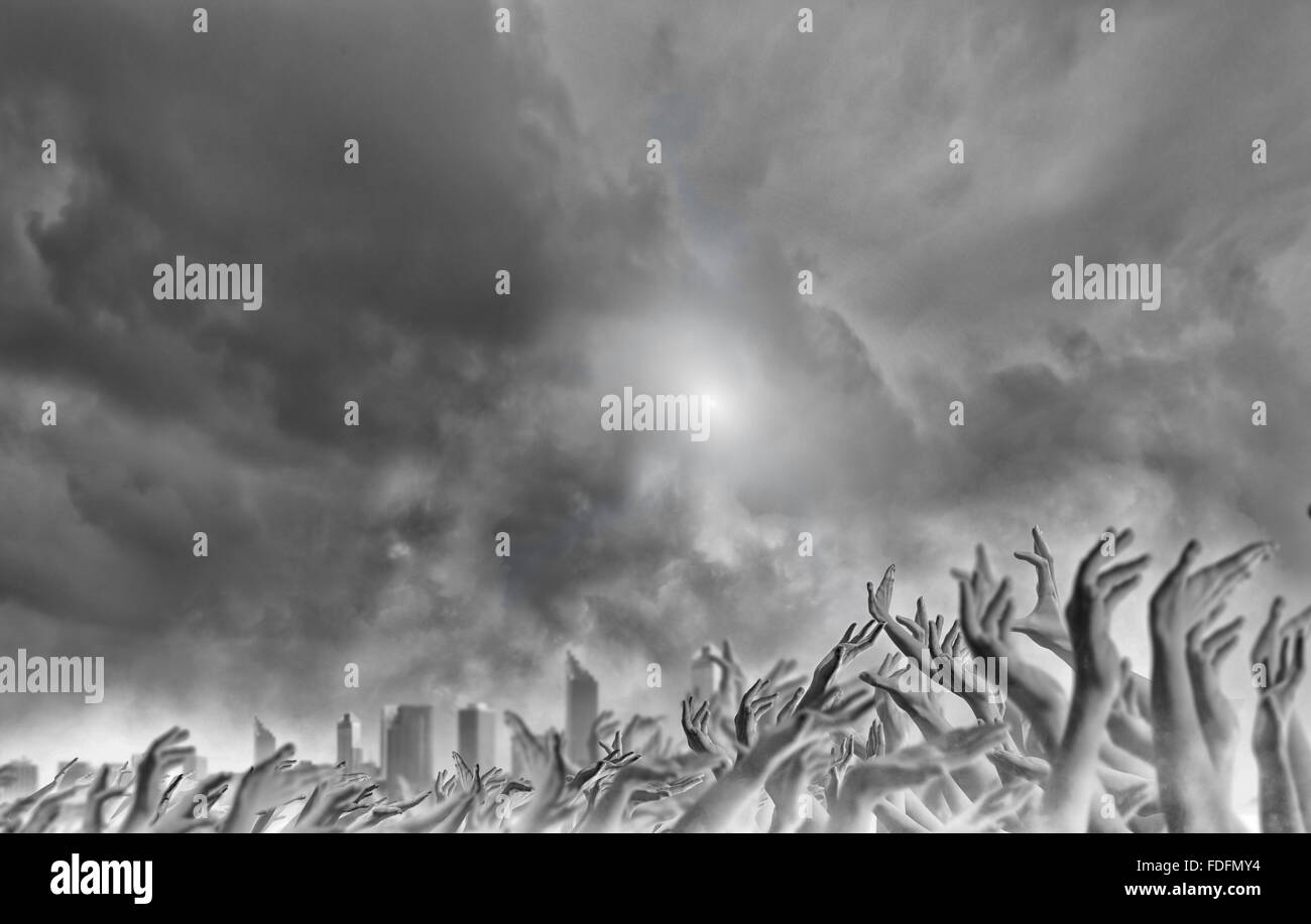 Crowd of people with hands raised up in to sky Stock Photo - Alamy