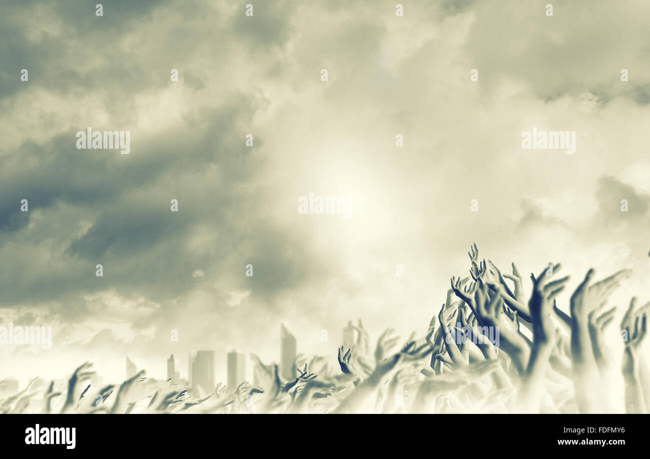 Crowd of people with hands raised up in to sky Stock Photo - Alamy