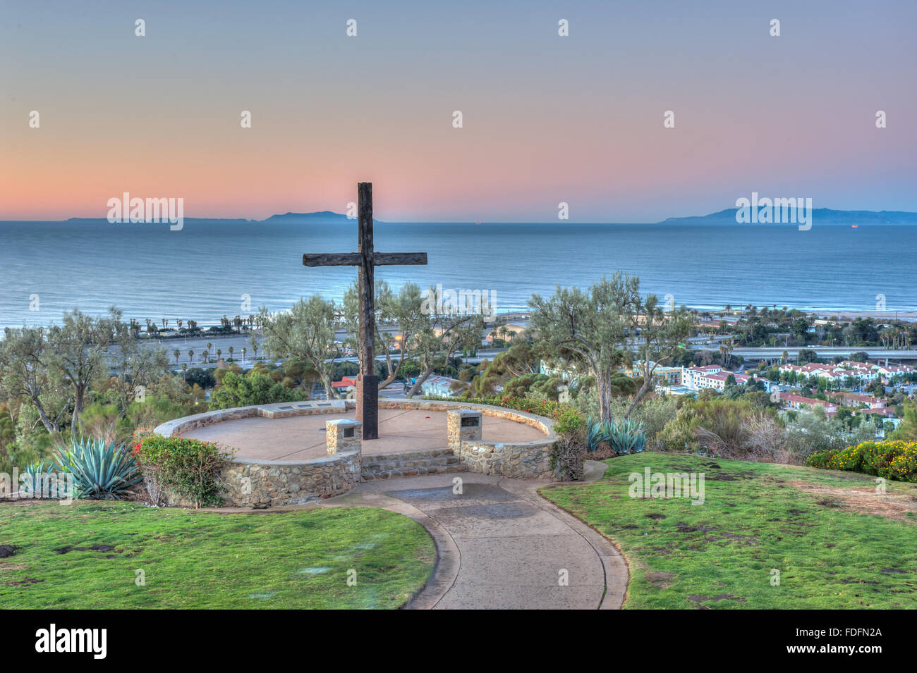 Christian cross with Island and ocean horizon in background Stock Photo ...