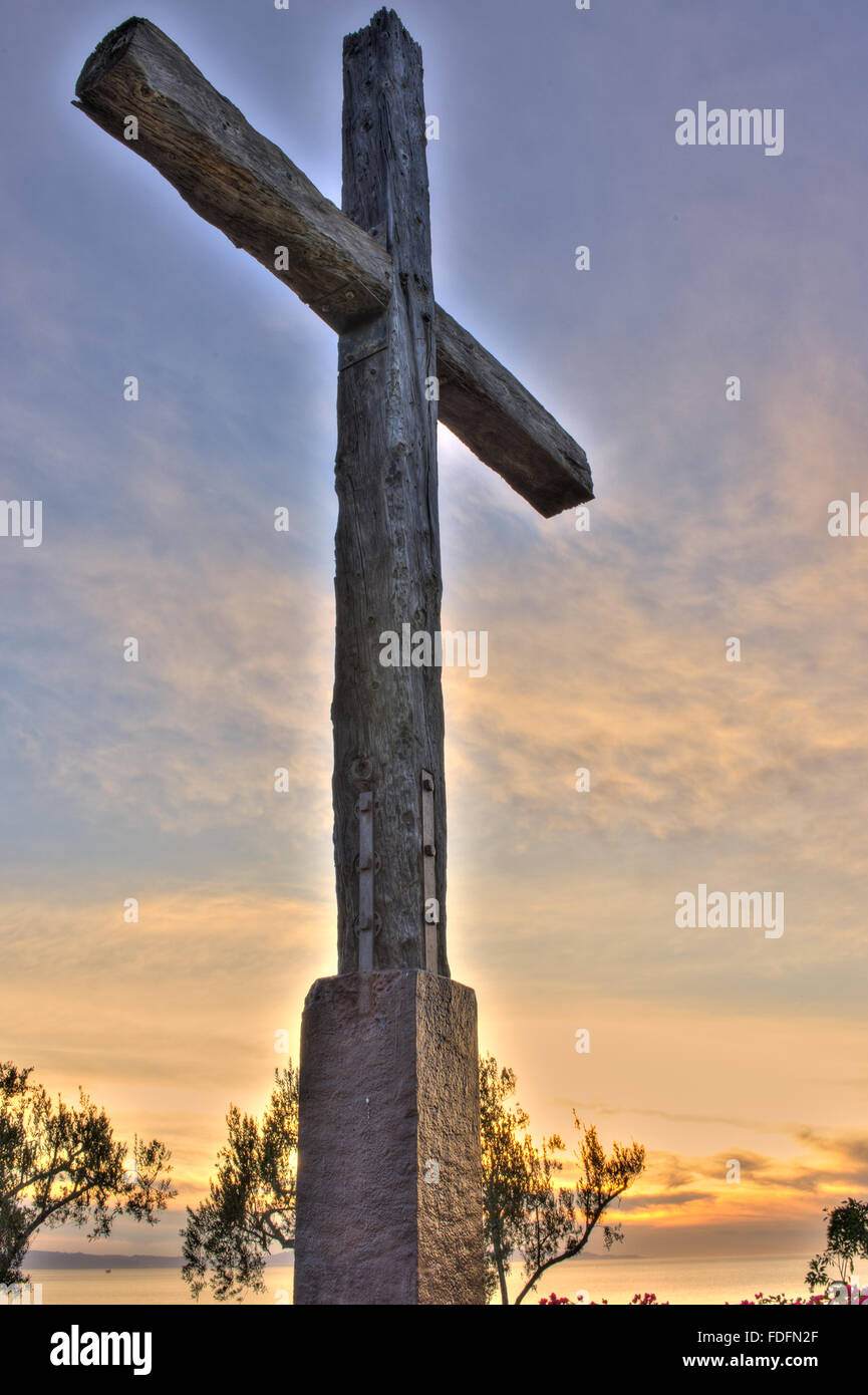 Christian cross with sunset sky behind Stock Photo - Alamy