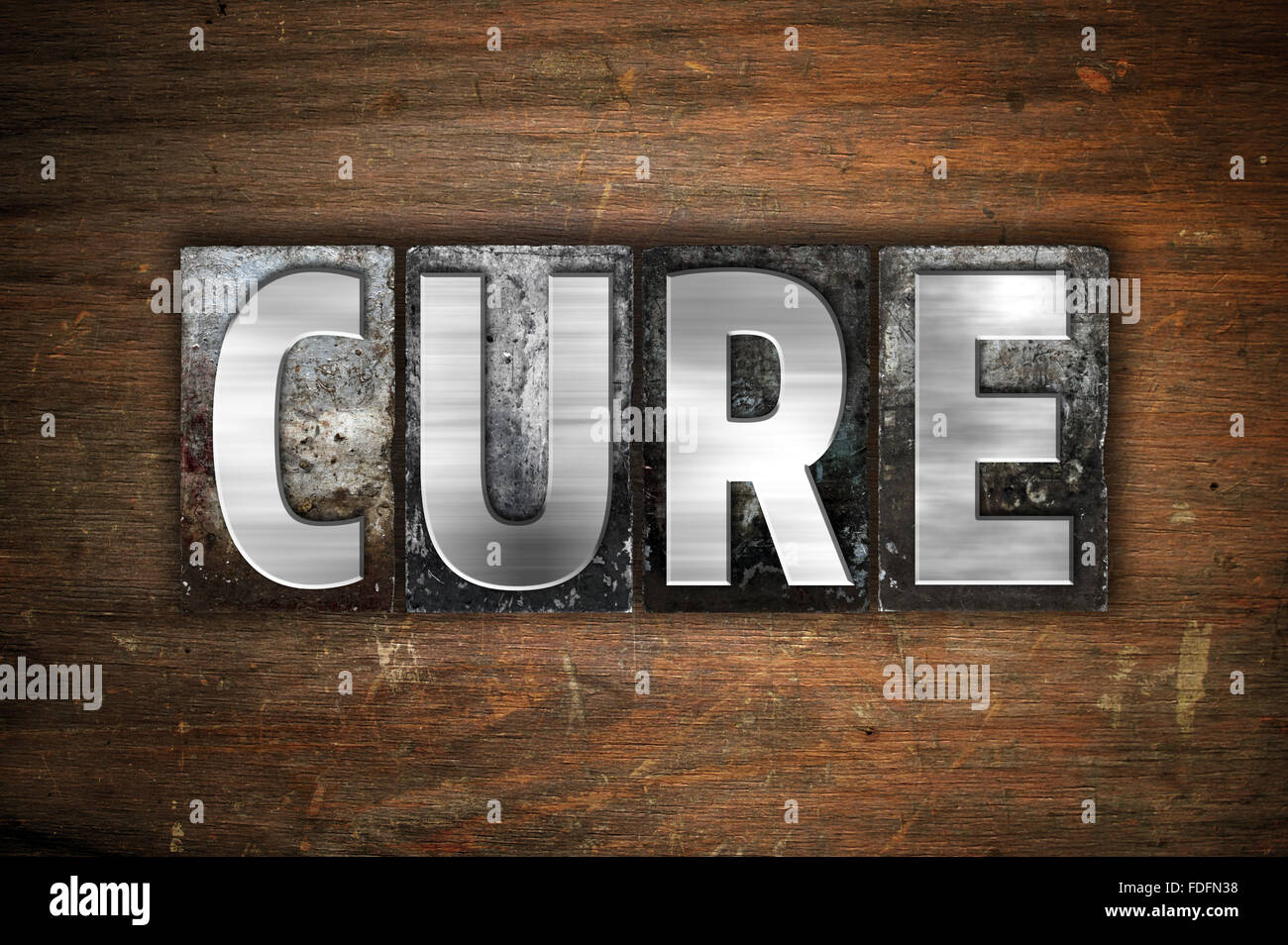 The word "Cure" written in vintage metal letterpress type on an aged ...
