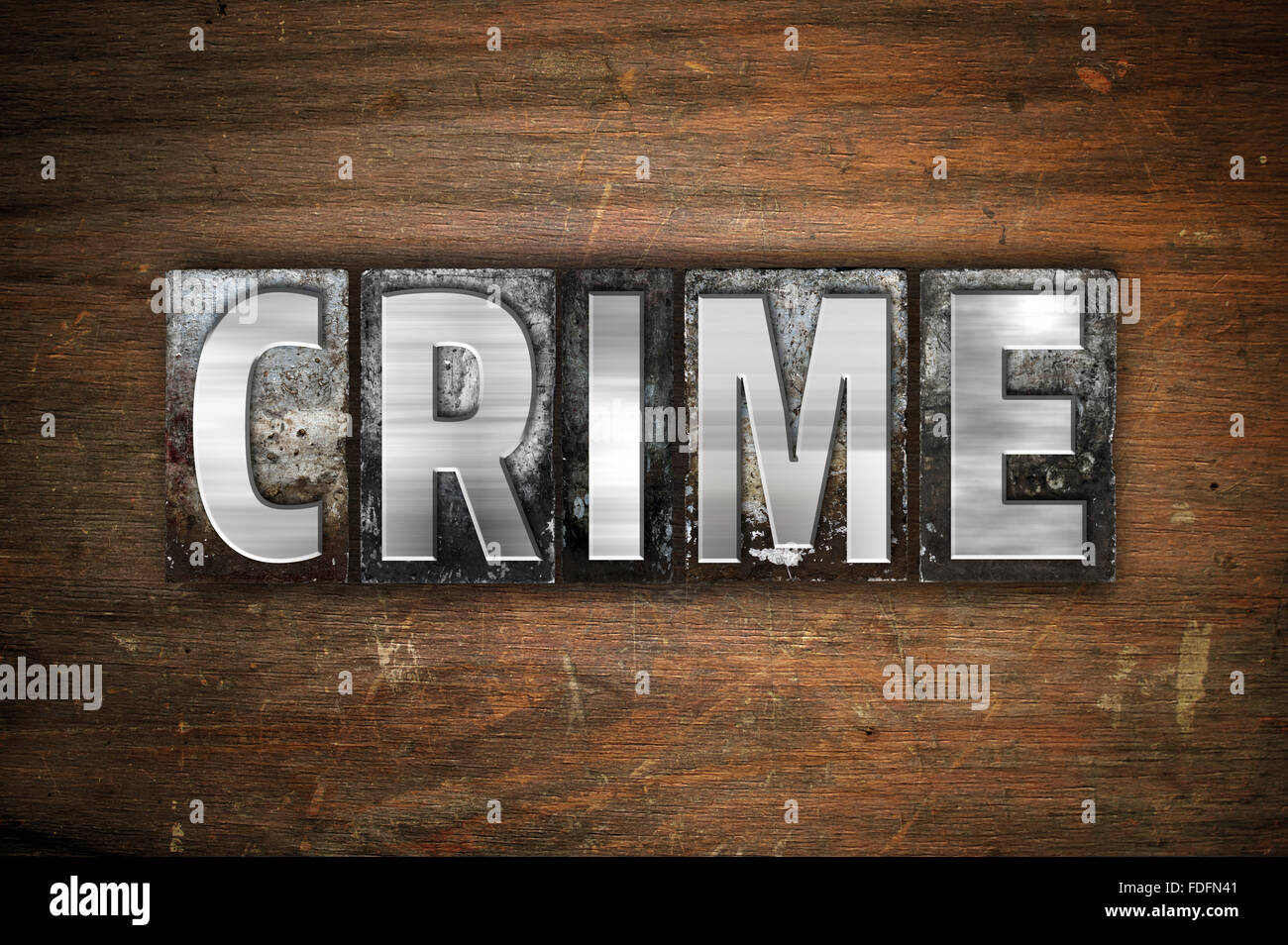The word "Crime" written in vintage metal letterpress type on an aged ...