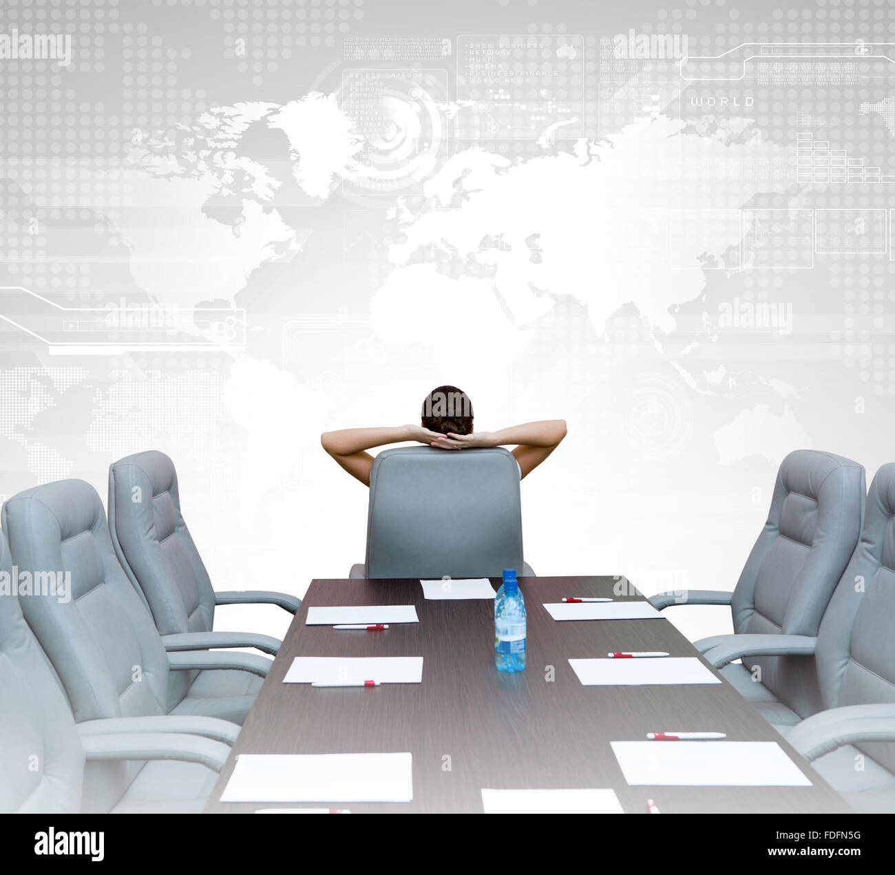 Businesswoman boss in conference room sitting with back in chair Stock ...