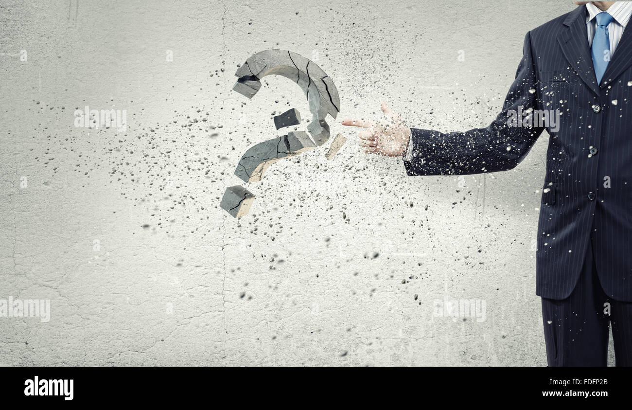 Businessman crushing question stone mark with finger touch Stock Photo ...