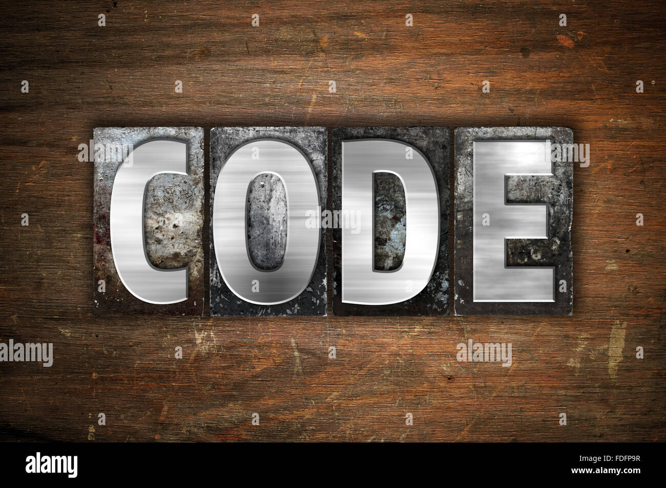 The word "Code" written in vintage metal letterpress type on an aged ...