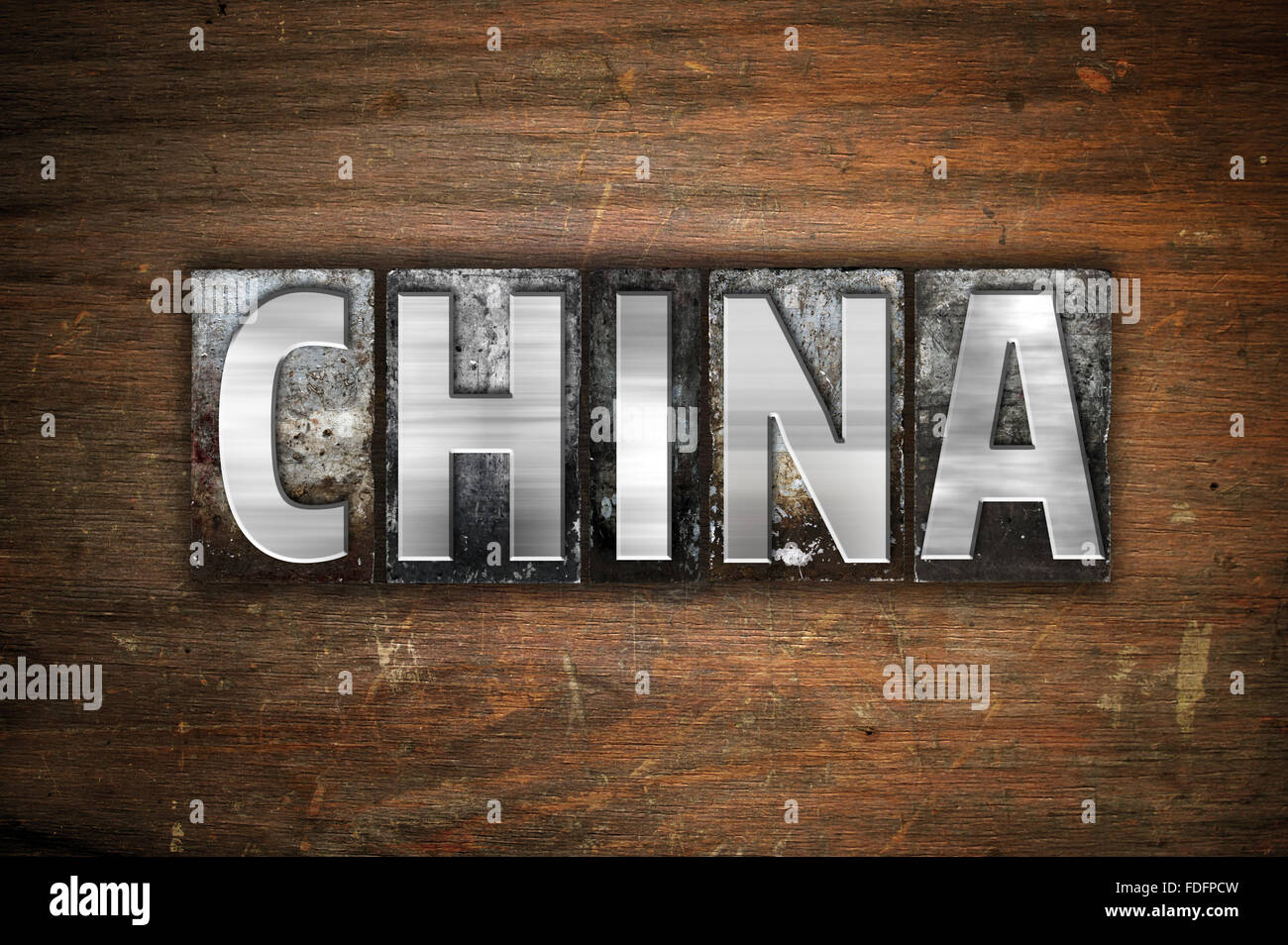 The word "China" written in vintage metal letterpress type on an aged ...