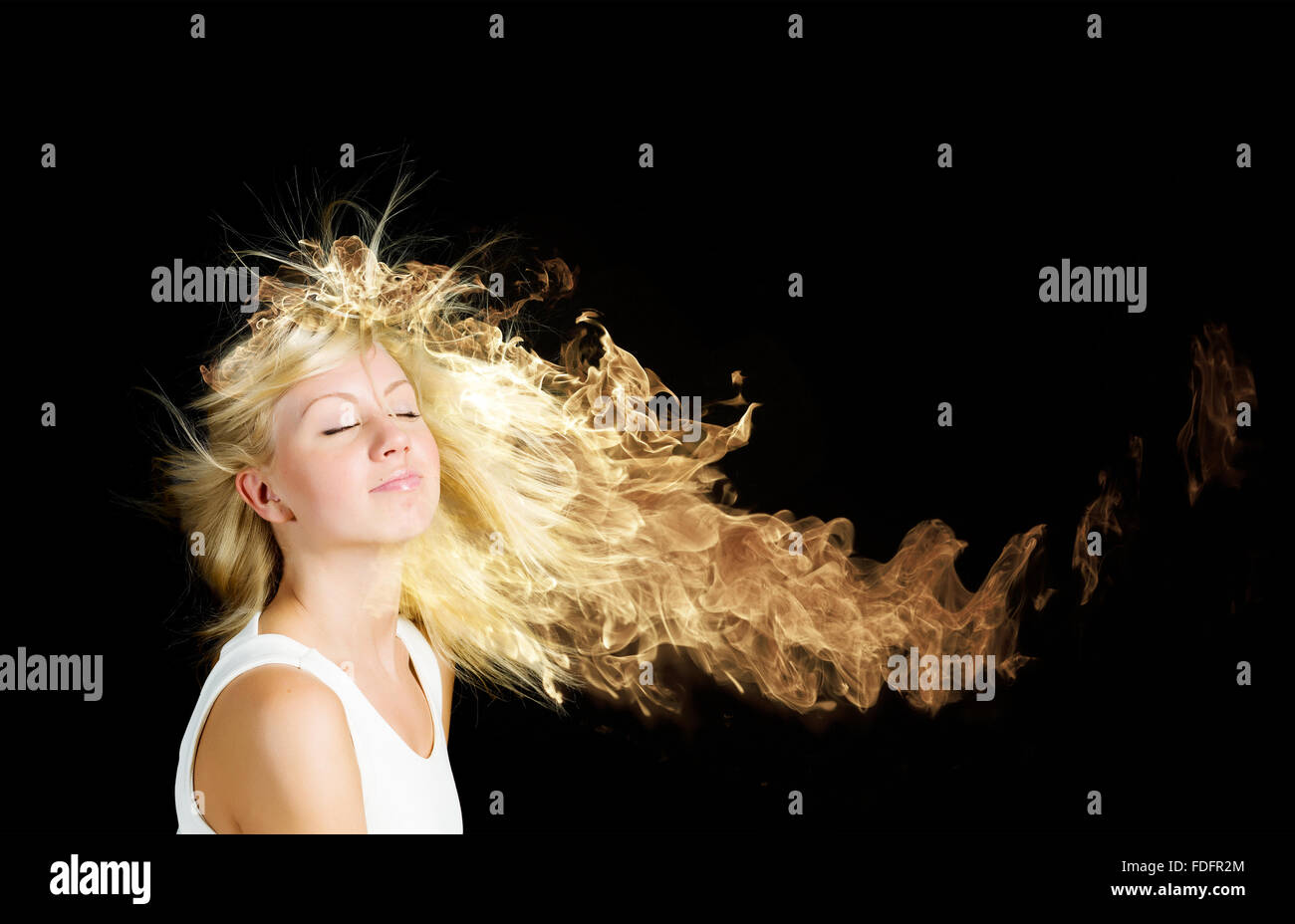 Young attractive blond girl with hair burning with fire Stock Photo - Alamy