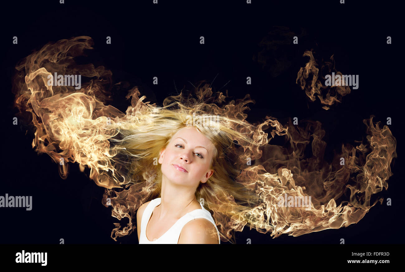 Young attractive blond girl with hair burning with fire Stock Photo - Alamy