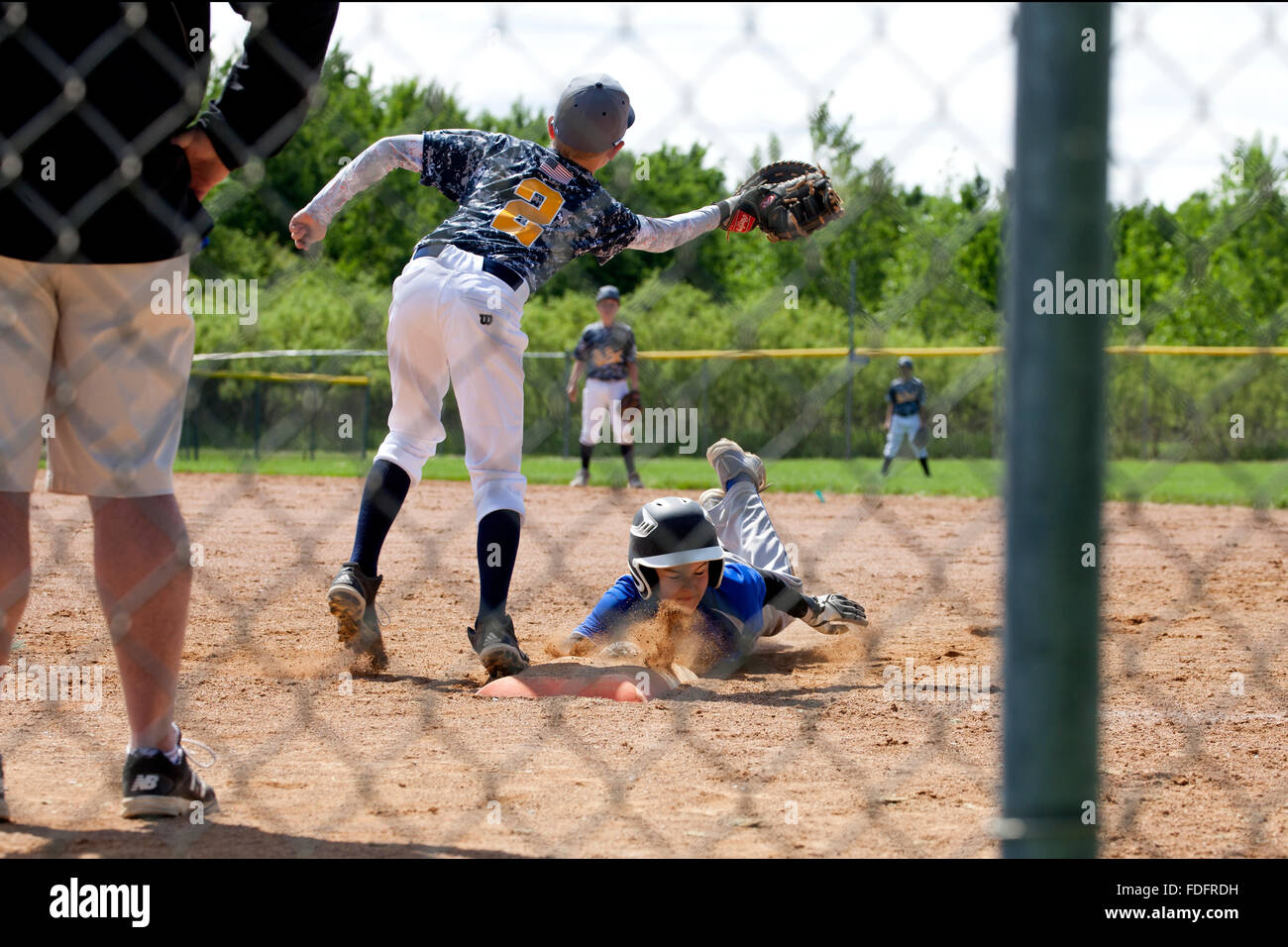 Boys sliding hi-res stock photography and images - Alamy