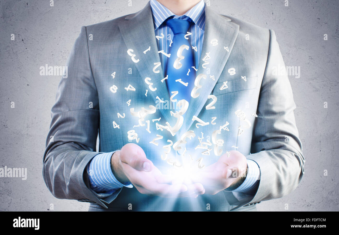 Close of businessman holding numerals in palms Stock Photo - Alamy