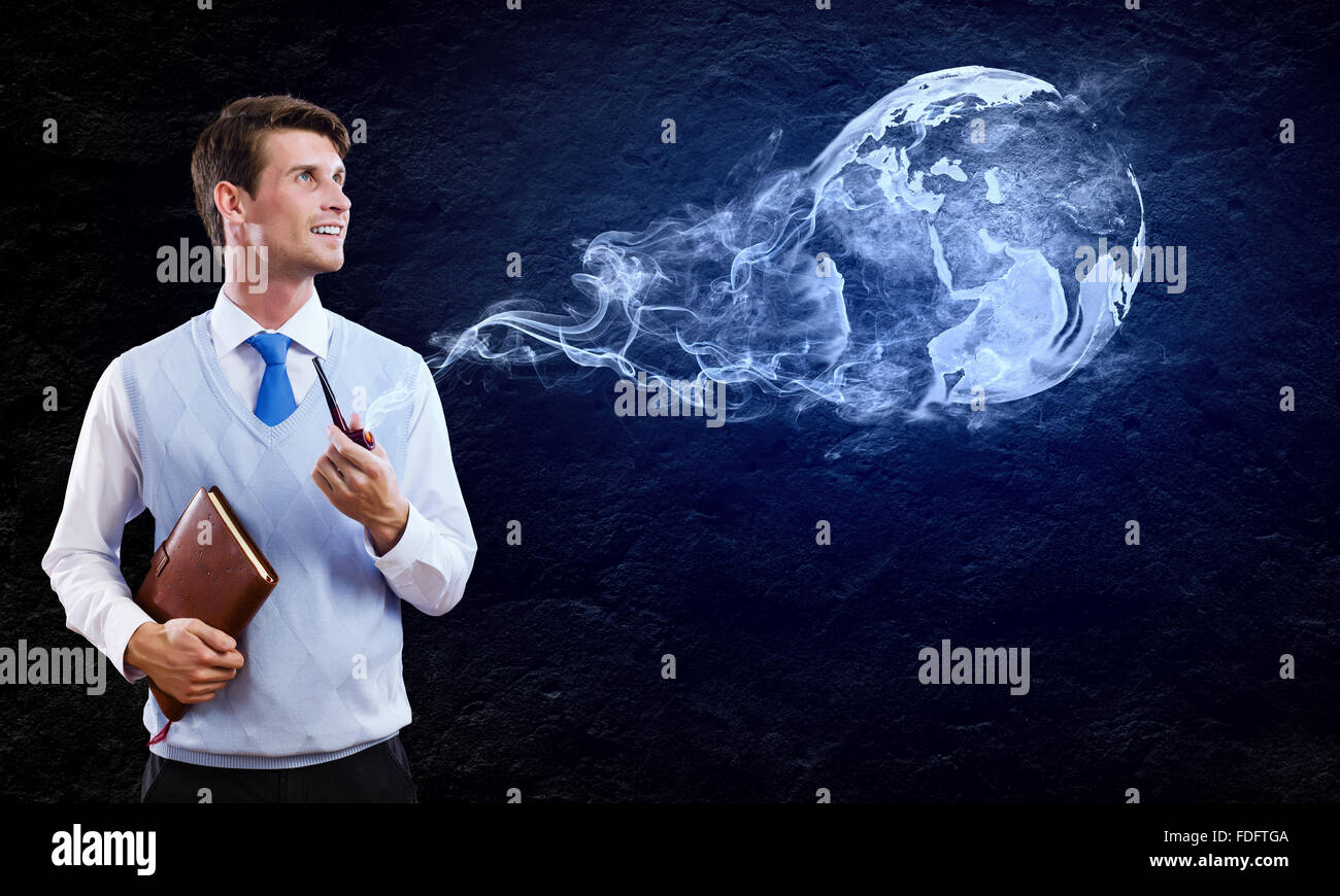 Conceptual image of young handsome man smoking pipe Stock Photo - Alamy