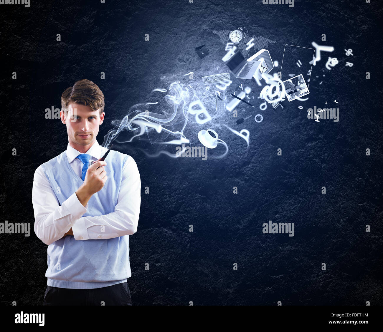 Young handsome businessman smoking pipe with business items at ...