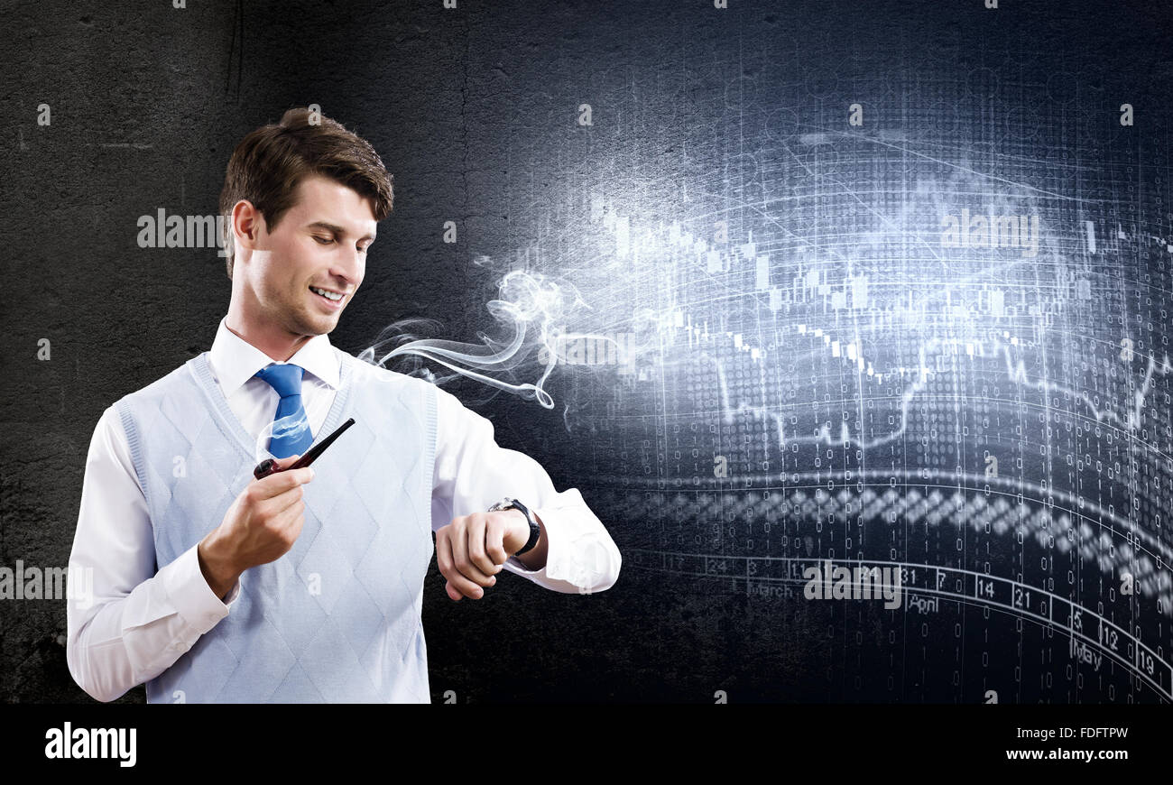 Young businessman smoking pipe with diagrams and graphs at background ...