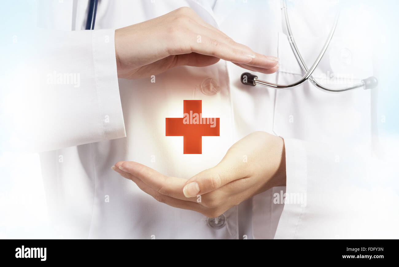 Close up of doctor hands with medicine cross sign Stock Photo - Alamy