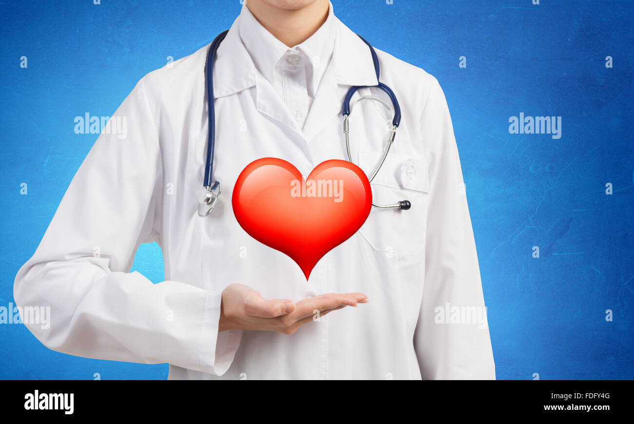Close up of female doctor holding heart in hands Stock Photo - Alamy