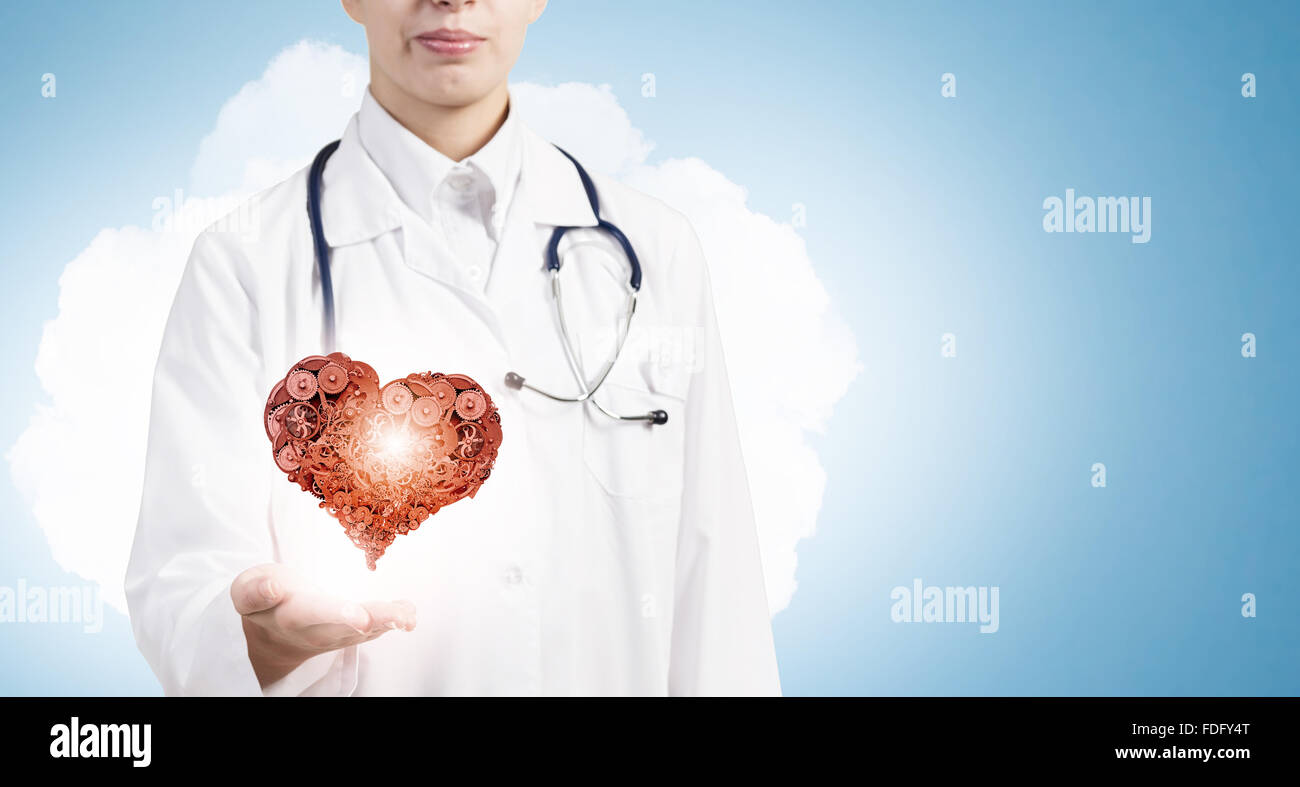 Close up of female doctor holding heart in hands Stock Photo - Alamy