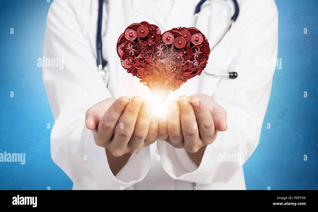 Close up of female doctor holding heart in hands Stock Photo - Alamy