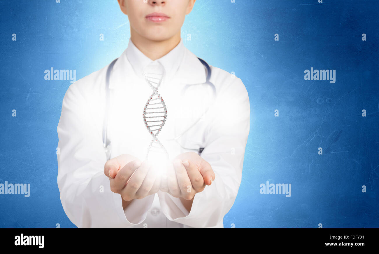 Close up of female doctor holding DNA molecule in hands Stock Photo - Alamy