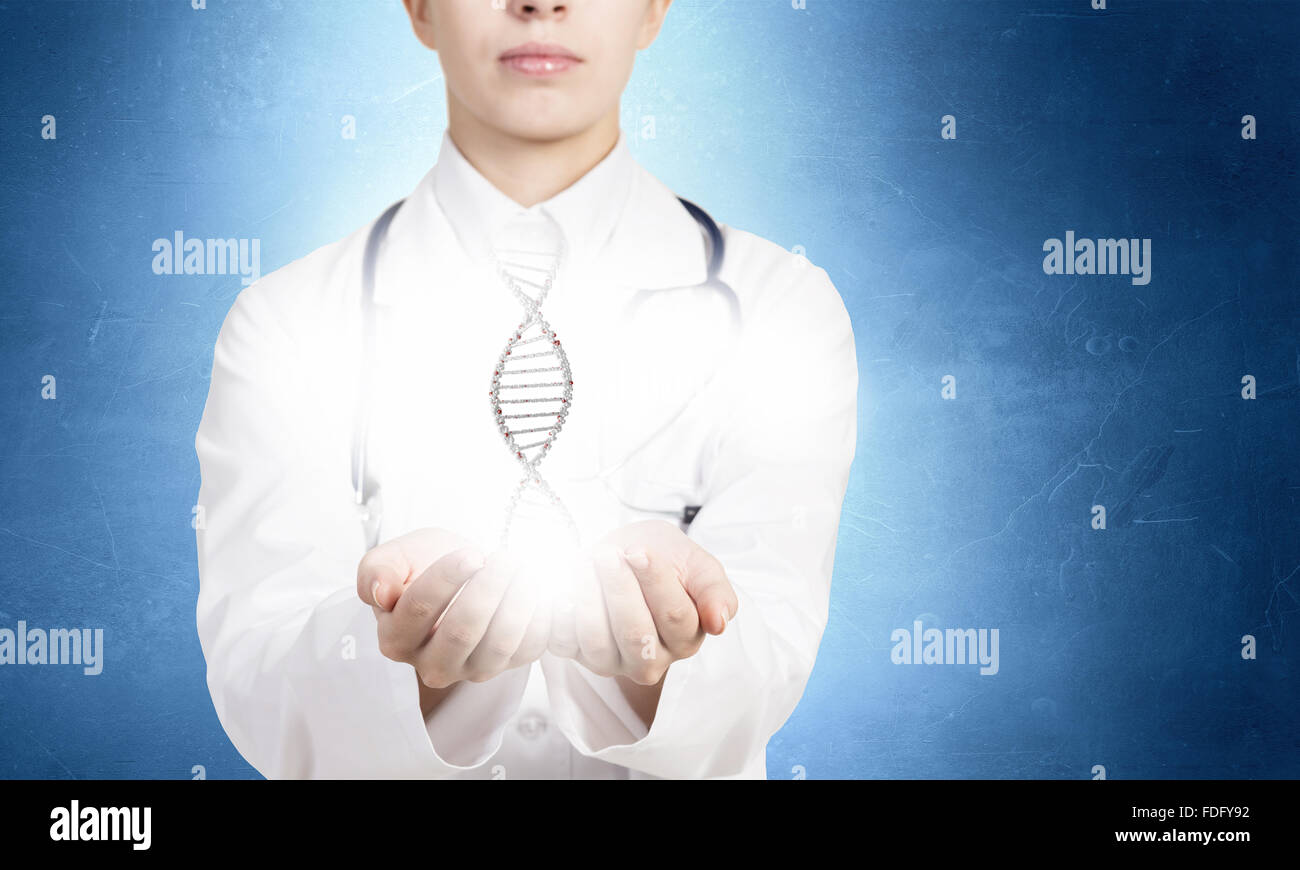 Close up of female doctor holding DNA molecule in hands Stock Photo - Alamy
