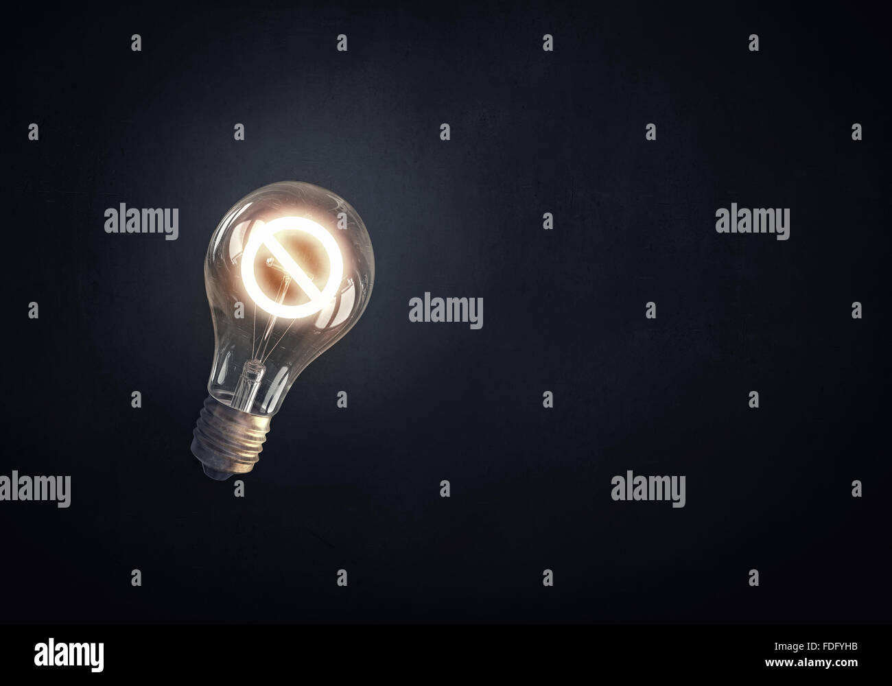 Glass glowing light bulb with prohibition sign inside Stock Photo - Alamy